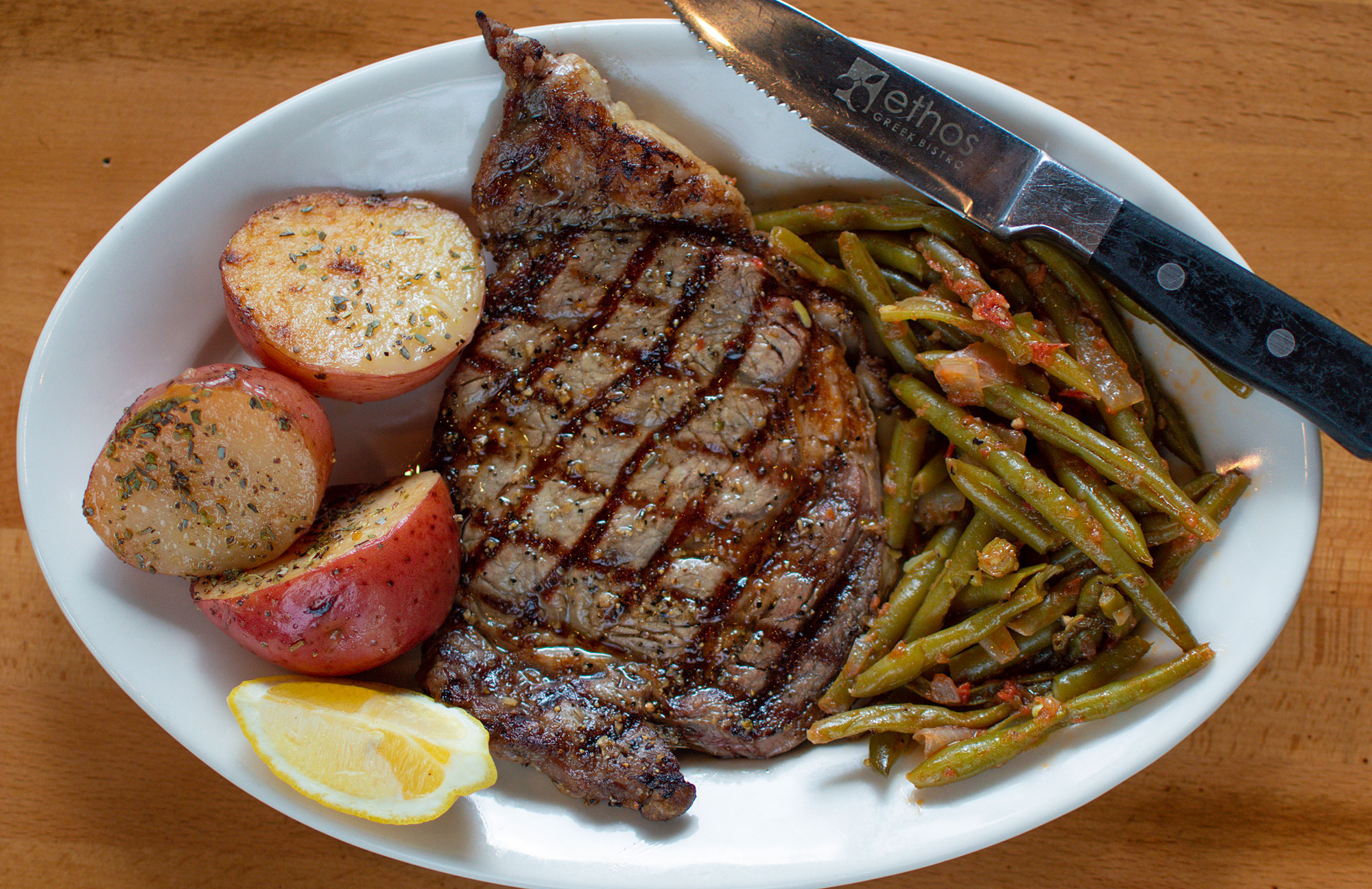 Prime Ribeye Steak 12 oz from our Dinner Menu at ethos Greek Bistro